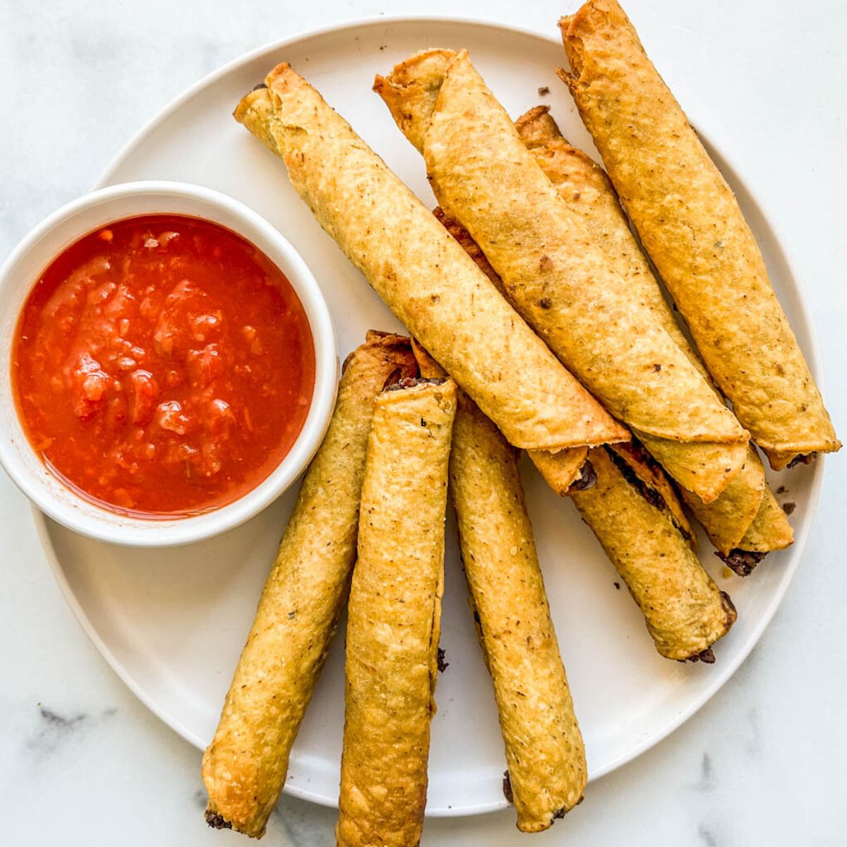 How to Air Fry Frozen Taquitos - Freezer Foodie